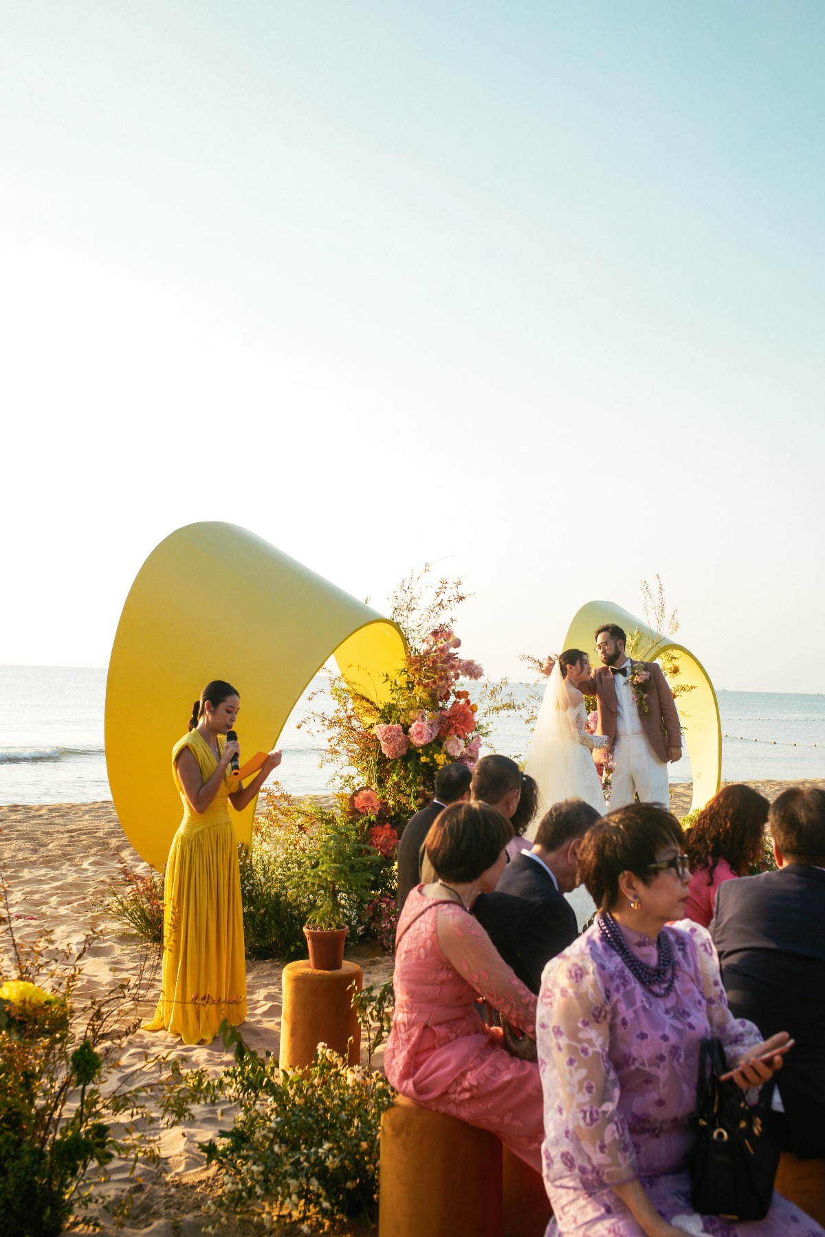 Vibrant beach wedding in vietnam with a psychedelic rainbow reception ...